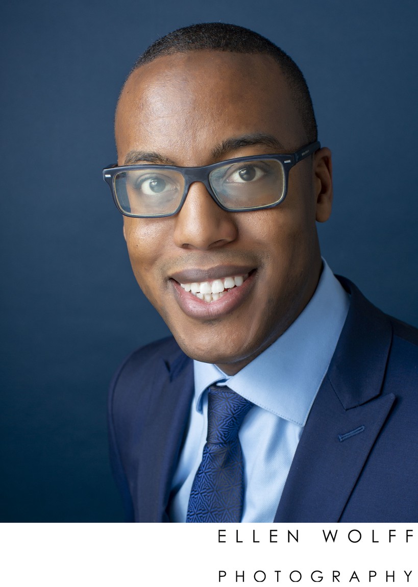 medical student headshot on a blue background - Ellen Wolff Photography