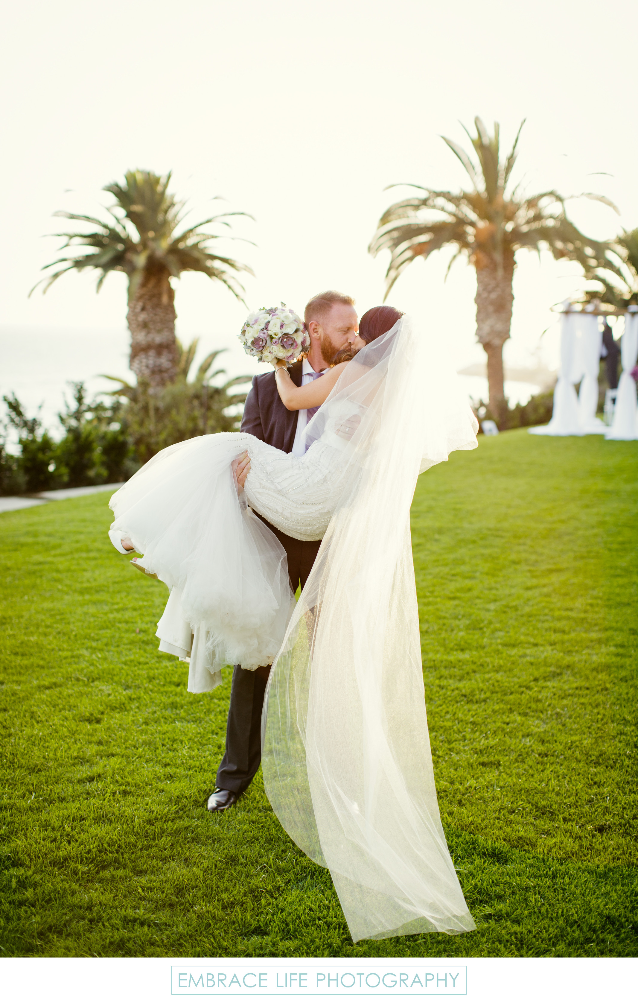 Groom Lifts Bride in His Arms for Kiss - Bel-Air Bay Club Wedding ...