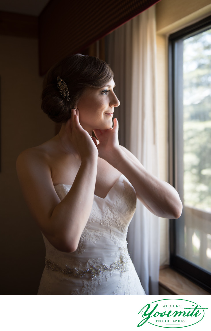 Bride Dresses At Window At Tenaya Lodge Yosemite Wedding Photographers