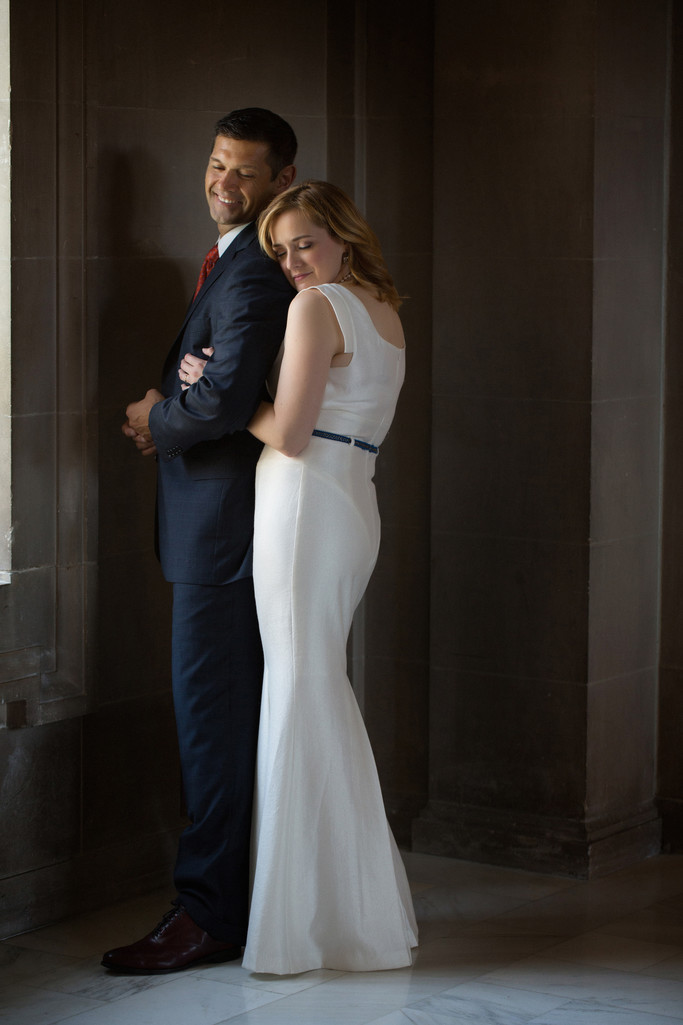 Couple In A Romantic Pose With Dark Background San Francisco City Hall Wedding Photographer