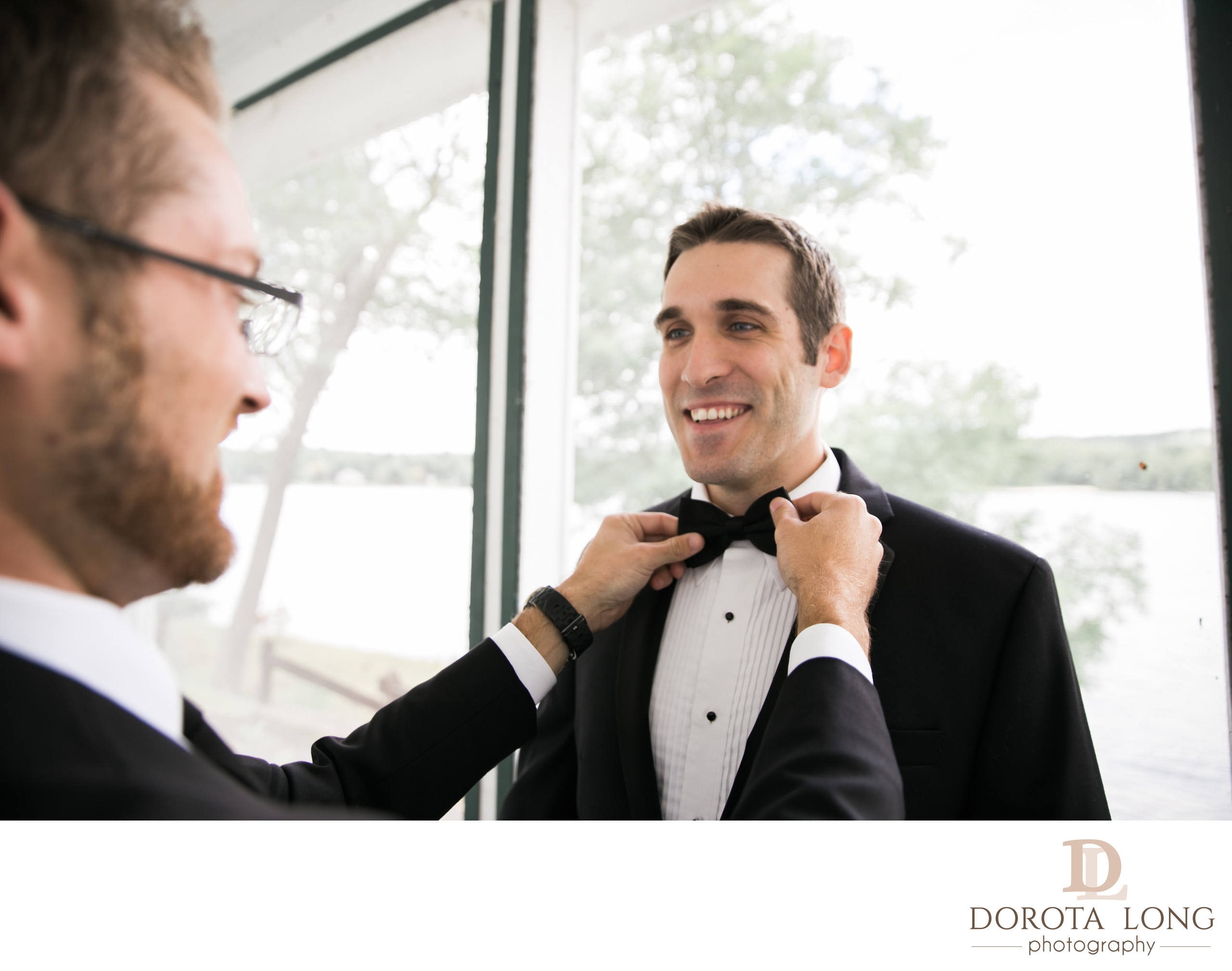 Best man helping the groom get ready. CT Wedding