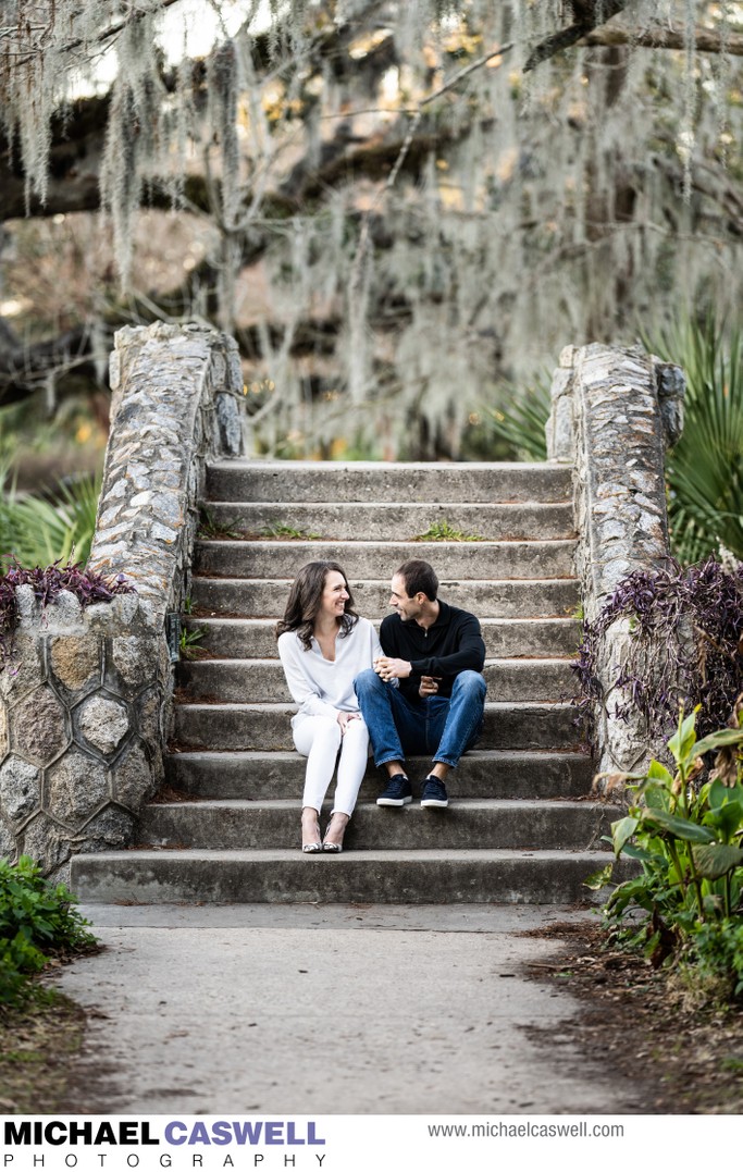 Couple Sits on Langles Bridge in City Park