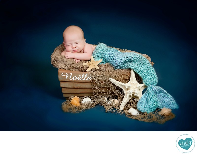 newborn baby in a mermaid tail on a tiny boat - Newborn Photography ...