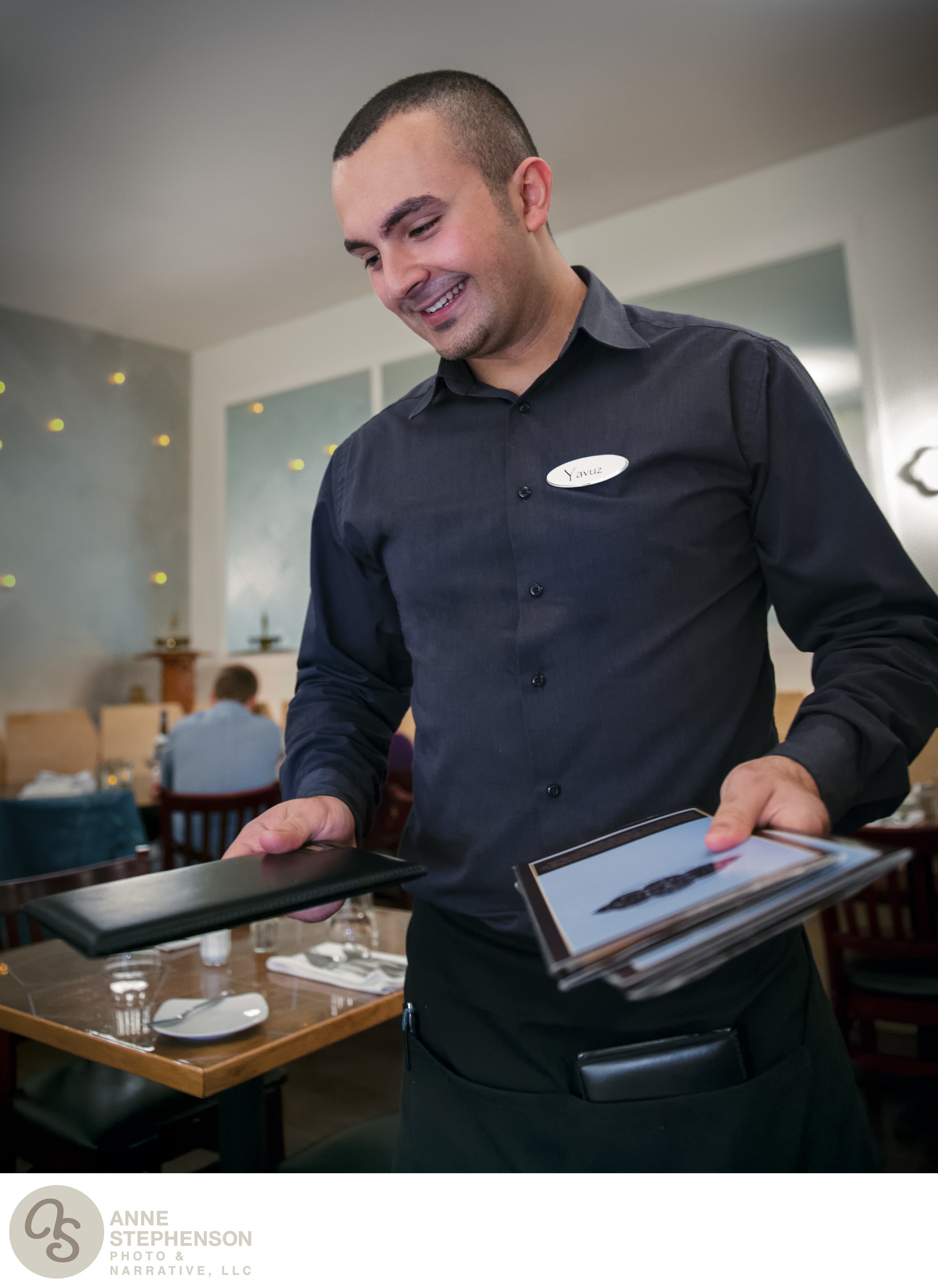 Waiter delivers menu with a smile at Greek restaurant - Denver Food ...